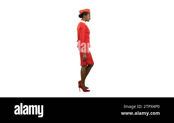 Stewardess goes and welcomes those around her. Alpha channel. Side view ...