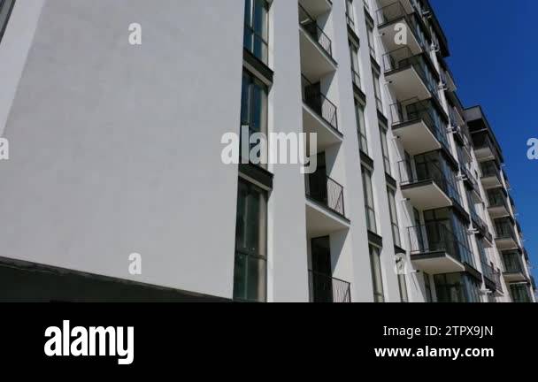 Facade of a newly built apartment building. Modern high-raised building ...