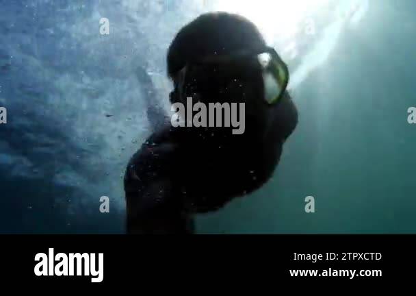 Man swimming underwater. Diving on the Black Sea. Man plunges into the ...