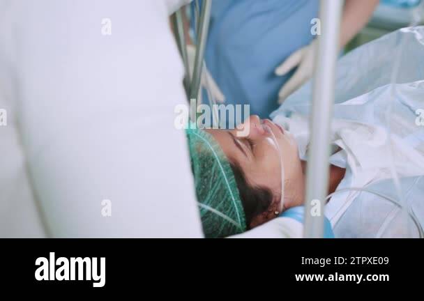Close up of patient during surgery. Woman lies on table under ...