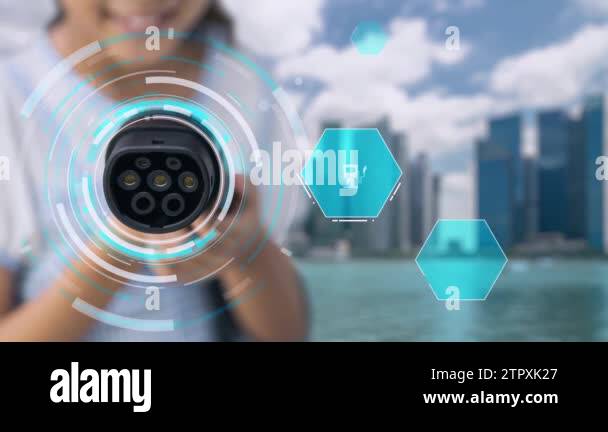 Focus young girl pointing EV charger in front of camera display eco ...