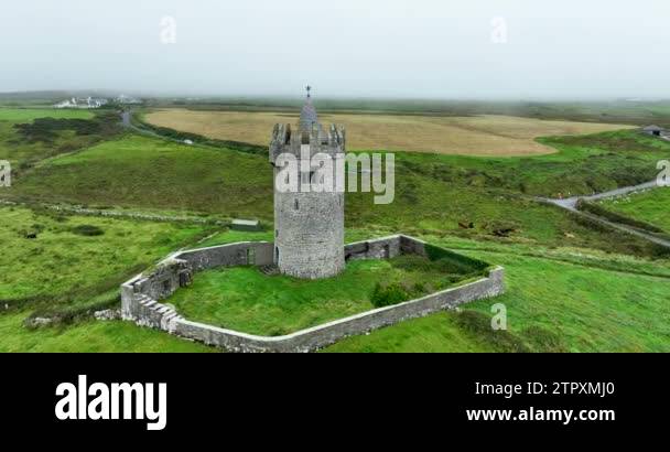 Aerial. Beautiful Doonagore Castle off the west coast of Ireland ...