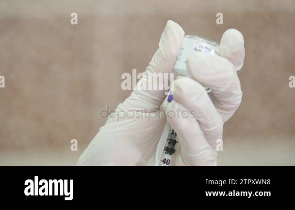 Medical doctor or nurse loading syringe for injection Stock Video ...