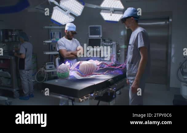 Diverse male surgeons in AR headsets work in operating room using ...