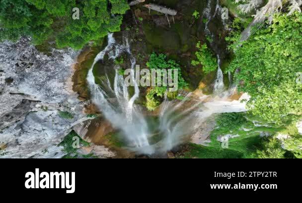 Beautiful waterfall in green forest, top view. One of the hidden gems ...