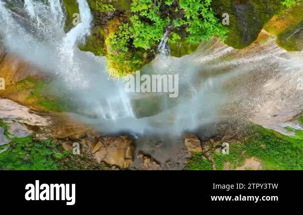 Beautiful waterfall in green forest, top view. One of the hidden gems ...