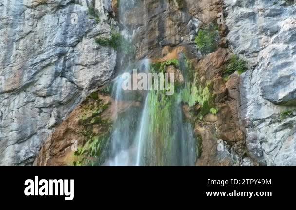 Beautiful waterfall in green forest, top view. One of the hidden gems ...