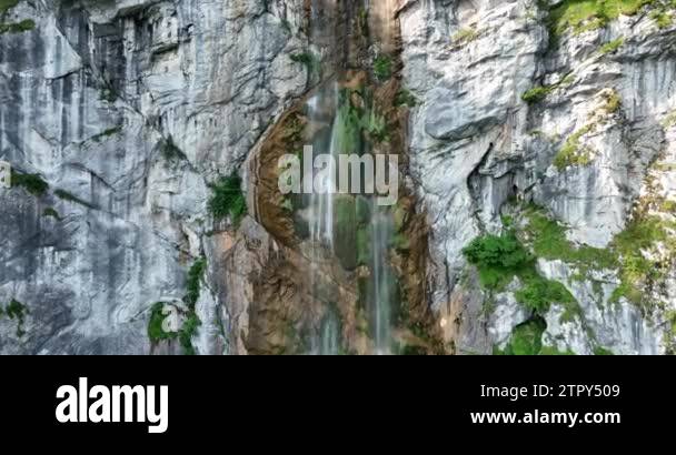 Beautiful waterfall in green forest, top view. One of the hidden gems ...
