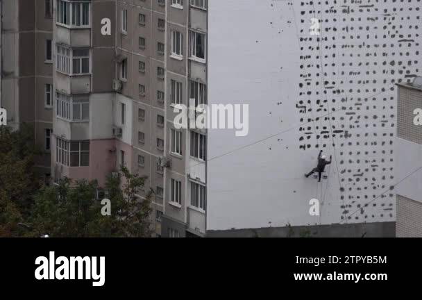High-altitude work in a residential area.Warming houses.High-altitude ...