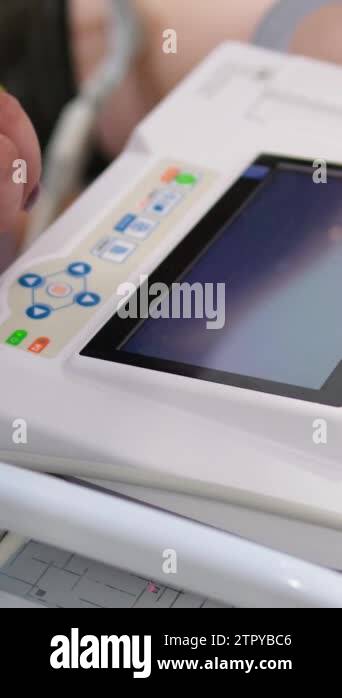 cardiogram in the hospital woman doctor examines a man patient puts ...