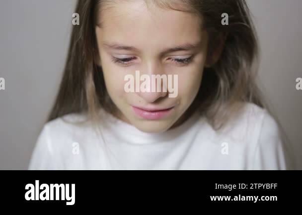 little girl crying with tears rolling down her cheeks Stock Video Footage - Alamy