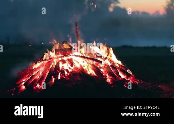 Big Campfire is Burning Down in Early Morning or Evening against the ...