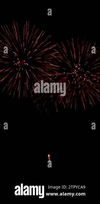4K vertical. seamless looping of real beautiful fireworks background ...