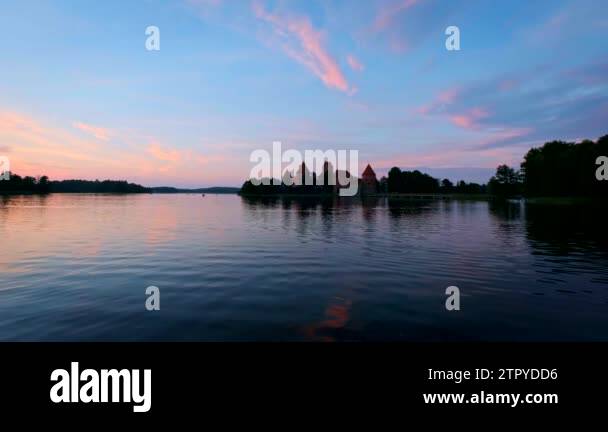 Trakai Island Castle in lake Galve, Lithuania on sunset with dramatic ...