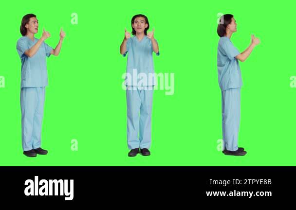 Healthcare medic does thumbs up sign against isolated full body ...