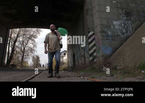 Man walking under bridge Stock Videos & Footage - HD and 4K Video Clips ...