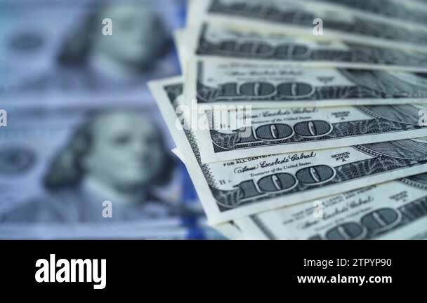 Edges of one hundred dollar bills rotating. American money background. Rotation of dollar ...