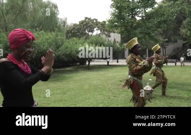 african women dancing a folk dance in traditional costumes and sing ...