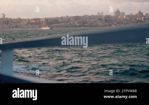 Top view of deck and side of wooden boat sailing on sea. Ship cuts ...