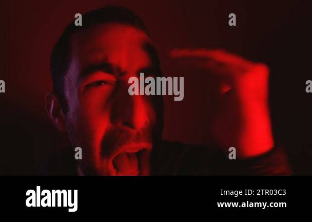 Man with angry facial expression screaming out loud and waving gesture ...