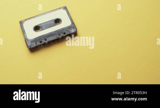 Video of retro tape with yellow label with copy space on yellow ...