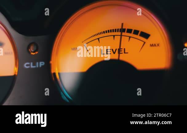 Analog round arrow indicator of audio signal level with yellow ...
