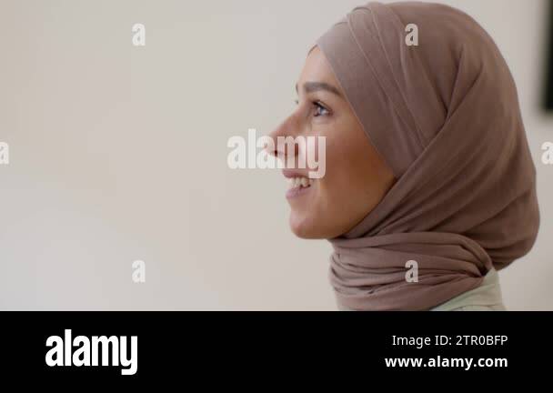 Islamic beauty. Close up side view portrait of beautiful young muslim ...