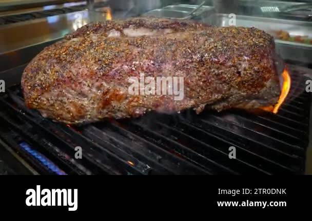 Grill the meat on the ribs. The meat is grilled with spices over an ...