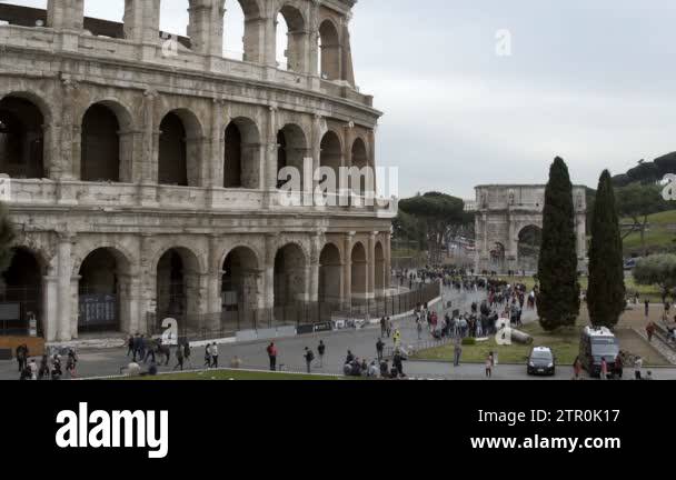 People exploring beautiful Coliseum amphitheater, tourism in Rome ...
