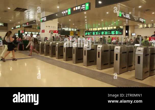 People using ticket gate at station Stock Video Footage - Alamy