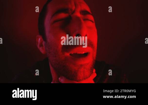 Man is choking and grabbing his neck with his hands Stock Video Footage ...