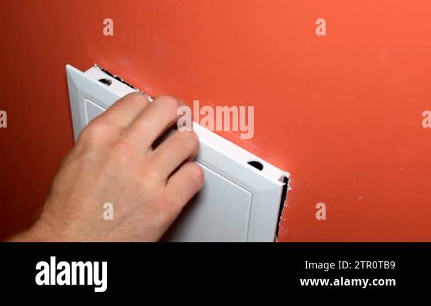 Installing inspection window in plasterboard wall Stock Video Footage ...