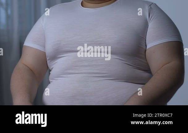 Sick obese male feeling chest pain, life-threatening heart problem ...