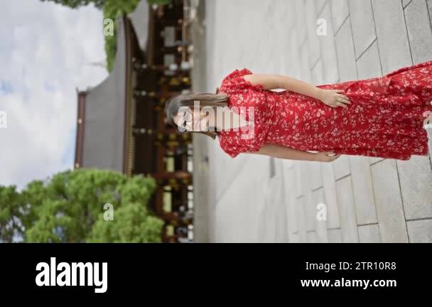 Beautiful hispanic woman donning glasses, smiling confidently, takes in ...