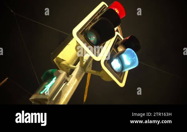 Traffic lights turn green and people cross the road, transportation ...