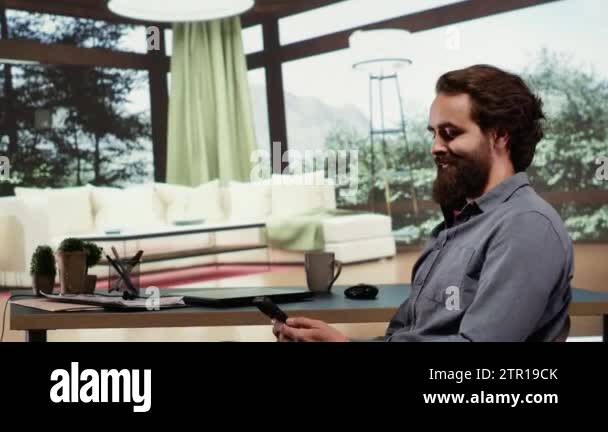 Successful billionaire sitting at his desk in luxury forest villa ...