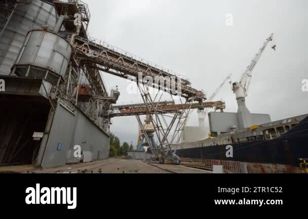 Timelapse of grain terminal at seaport on cloudy day. Cereals bulk ...
