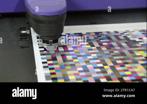 Press shop, spectrophotometer robot measurement of color patches in ...