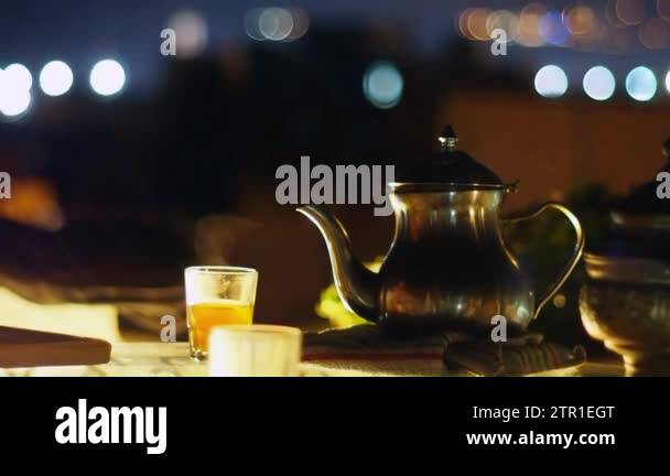 Traditional Metal Pot and Glasses With Steaming Moroccan Tea on the ...