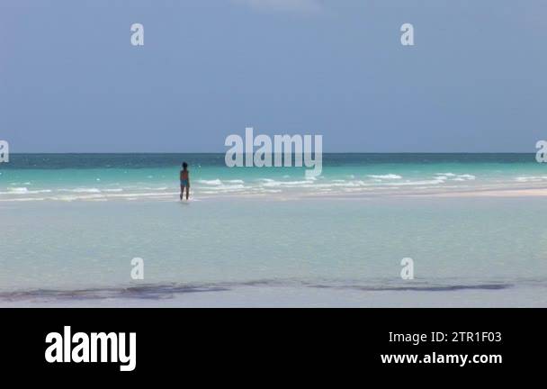 LUCAYAN BEACH/GRAND BAHAMA : Female in sea at beach Stock Video Footage ...