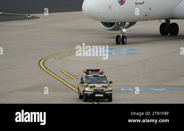 Airbus A320 is following after service car of Dusseldorf airport Stock ...