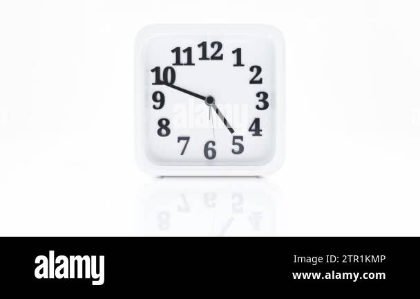 White rectangular alarm clock in white room. Designed in minimal ...