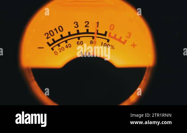 Analog round arrow indicator of audio signal level with yellow ...