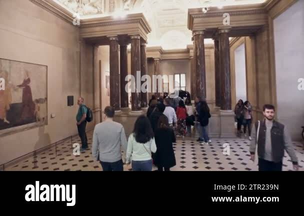 FRANCE, PARIS - circa JUN, 2017: Tourists visiting art gallery in Louvre Museum, one of largest ...