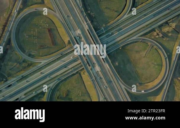 Freeway cloverleaf interchange Stock Video Footage - Alamy