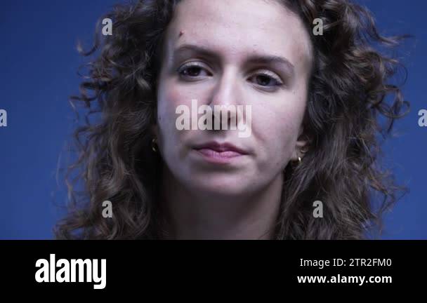 Woman in doubt listening close-up face with question mark expression ...