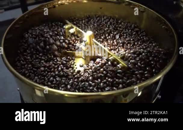 Roasting coffee beans using automatic coffee roasting machines, heat ...