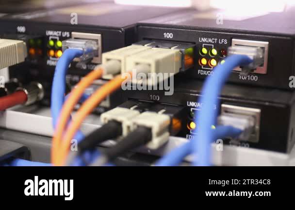 Details from loaded and working network switch with fiber media converter(focus light status ...