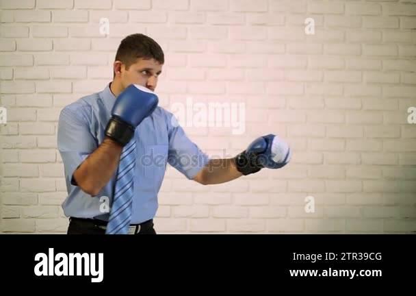 Boxing man in a shirt and tie. Businessman with boxing gloves. Manager ...