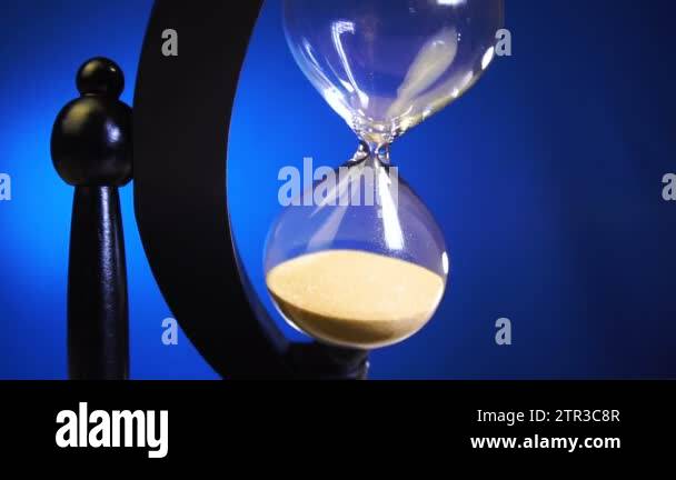 Time The Hourglass Turns The Hand And Begins The Countdown Of Five Minutes In Black And White